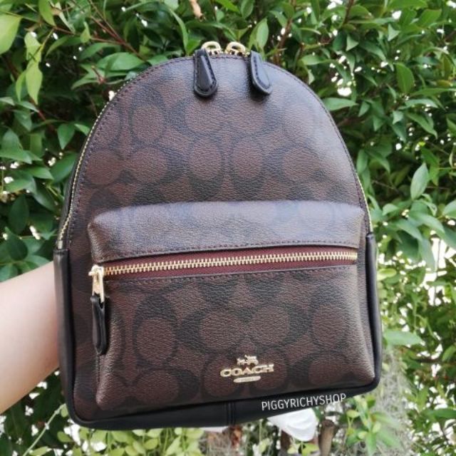 กระเป๋าเป้มินิ โค้ช MINI CHARLIE BACKPACK IN SIGNATURE GOLDBROWNBLACK ...