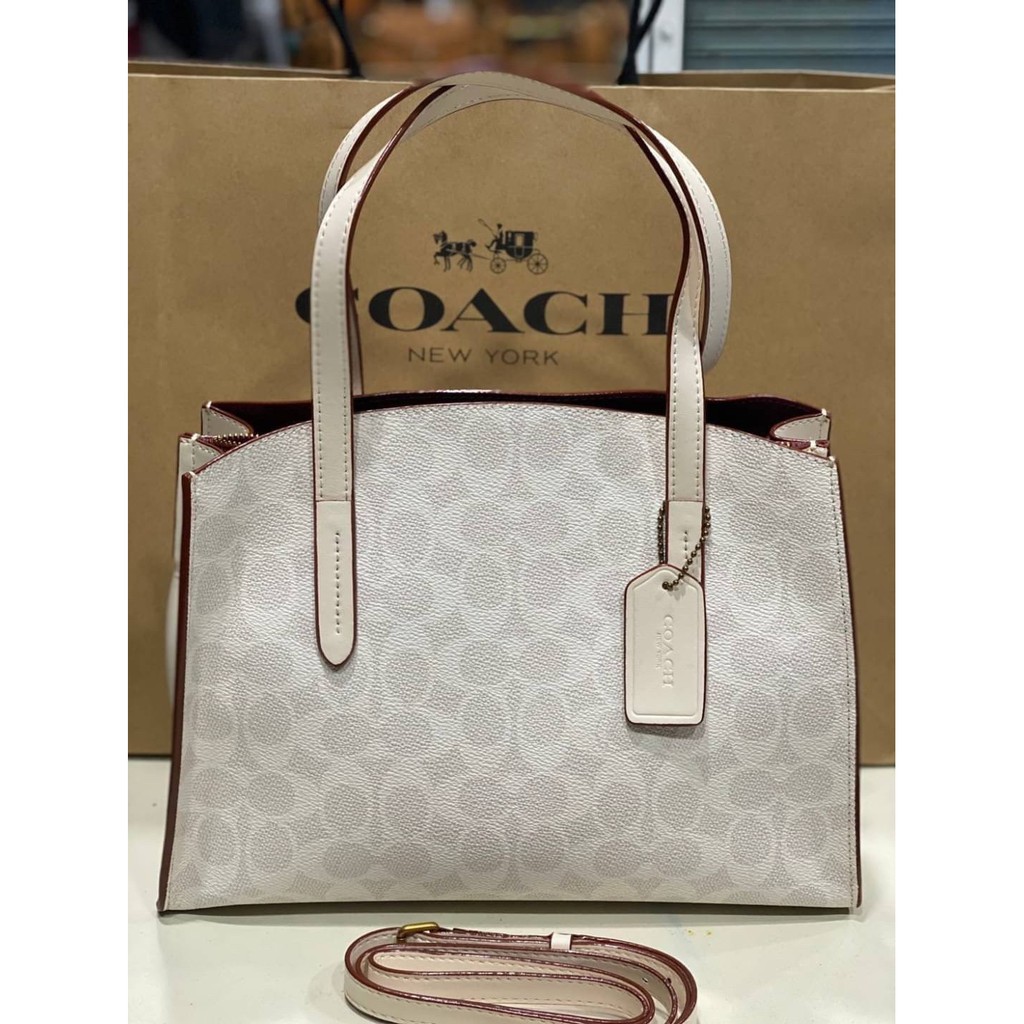 Coach Charlie Carryall 28 in Signature Canvas Brass/Rust Women Handbags ...