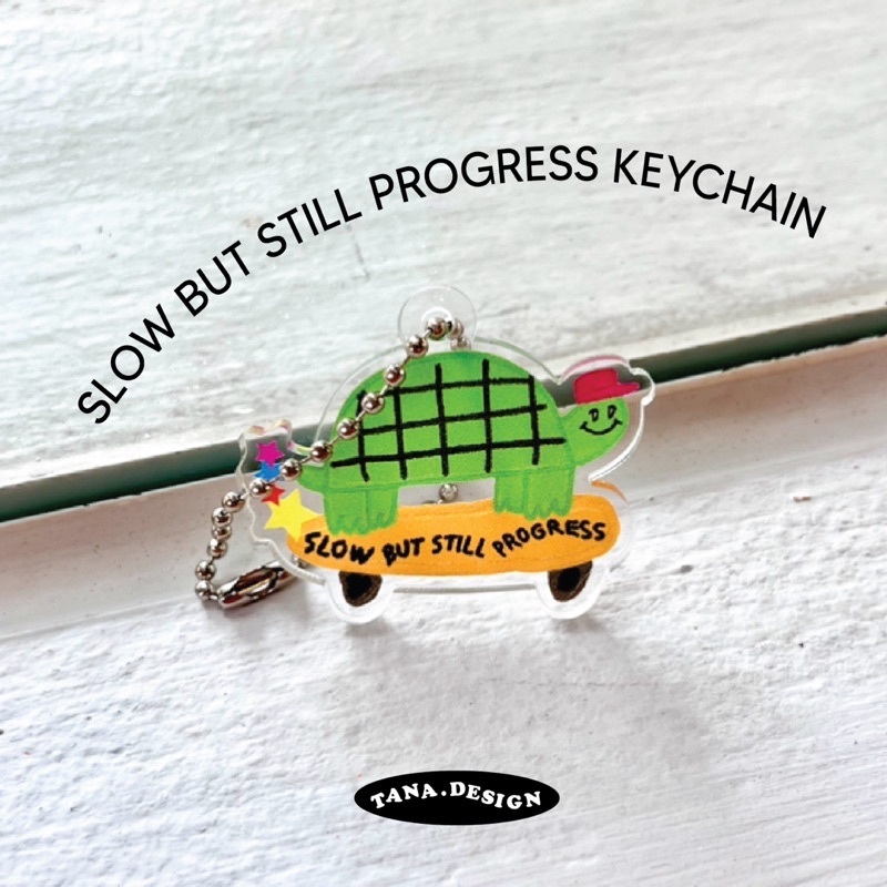 ‘Slow but still progress’ keychain | Shopee Thailand
